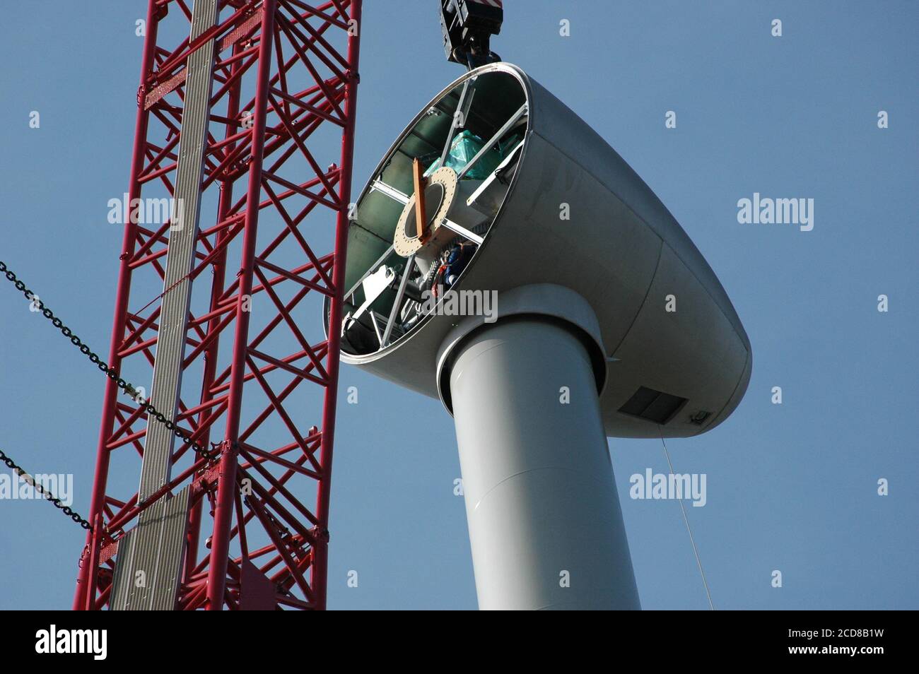 Windmill gondola is slowly lifted to be placed on the mast Stock Photo ...