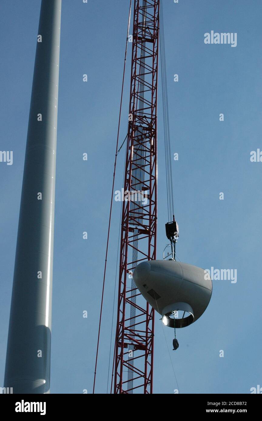 Windmill gondola is slowly lifted to be placed on the mast Stock Photo ...