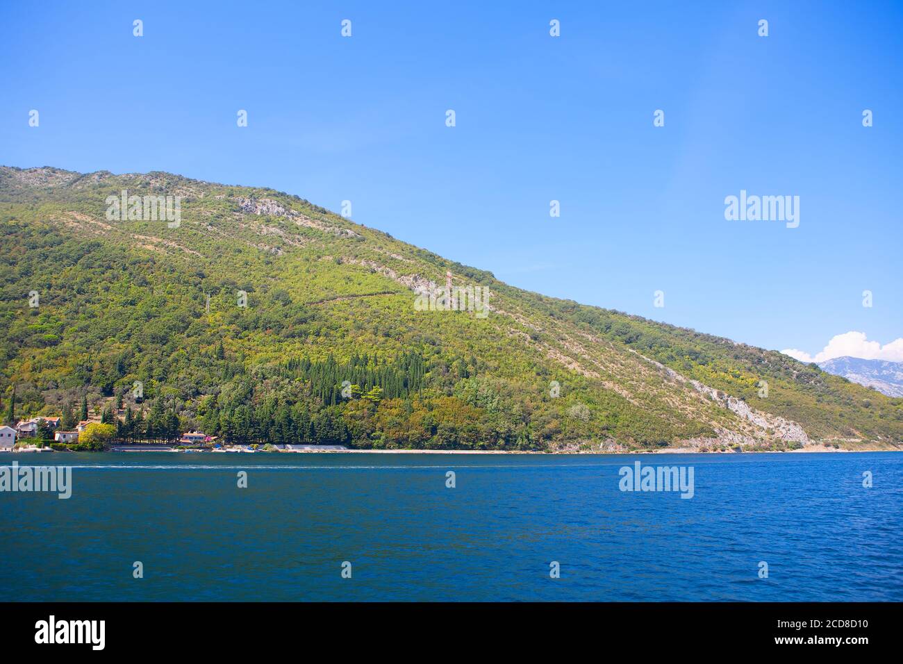 green coastal hill and blue sea Stock Photo - Alamy