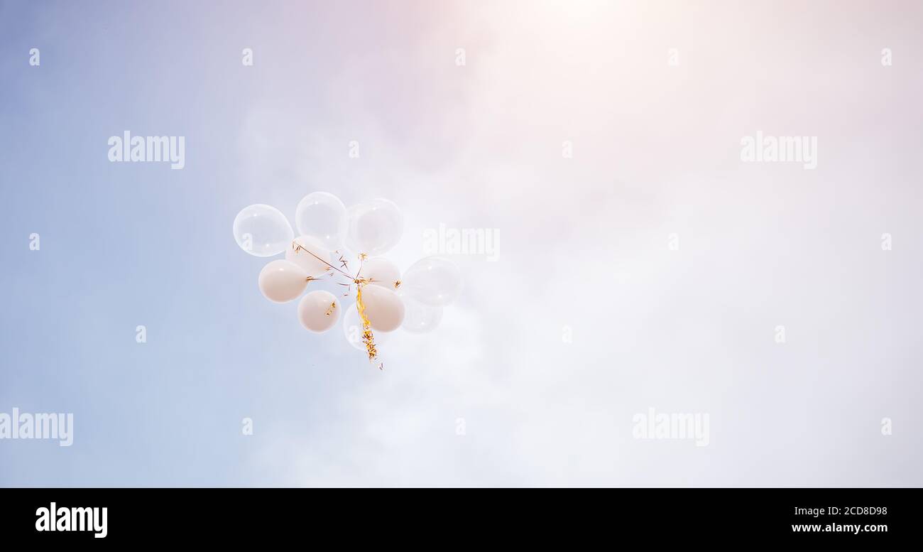 Helium balloons flying person hi-res stock photography and images - Alamy