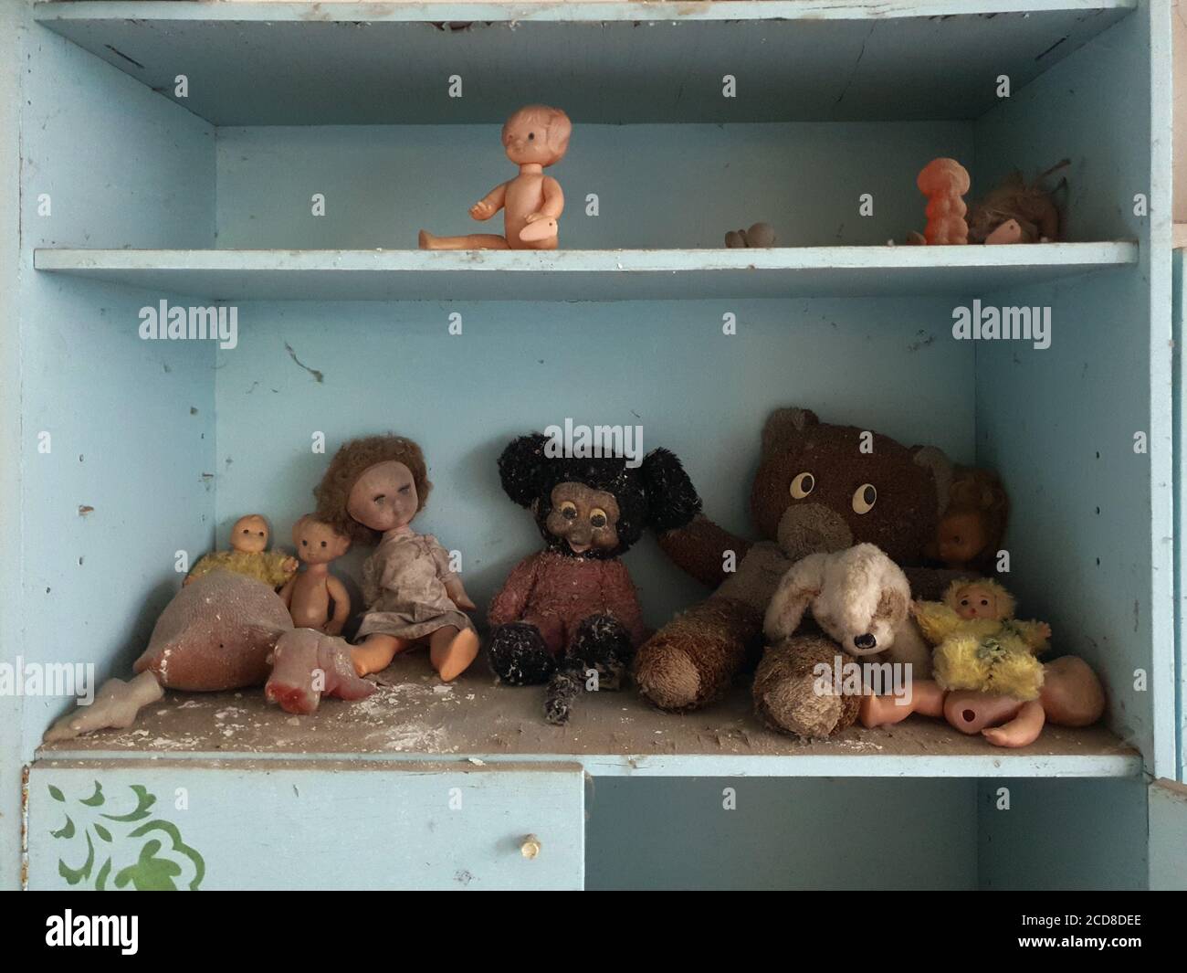 Stuffed plush toys and dolls, Cheburashka on a shelf in a closet in a ...