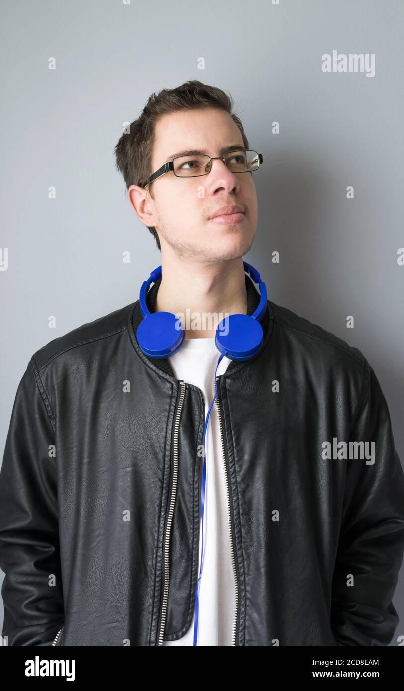 Teenager boy with glasses and headphones on his neck Stock Photo - Alamy
