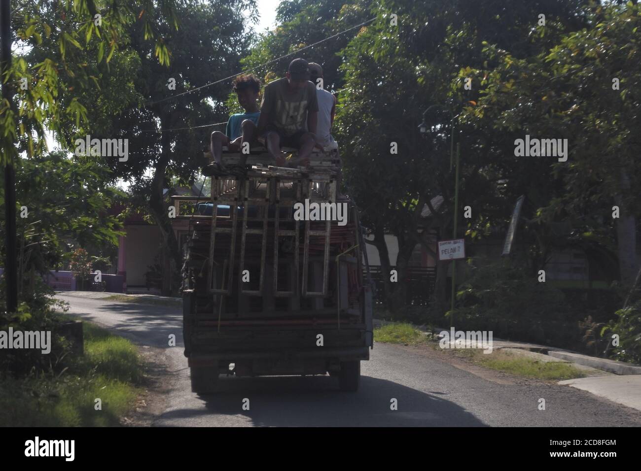 BLORA, INDONESIA - Aug 02, 2020: full passengers in a pick up car ...