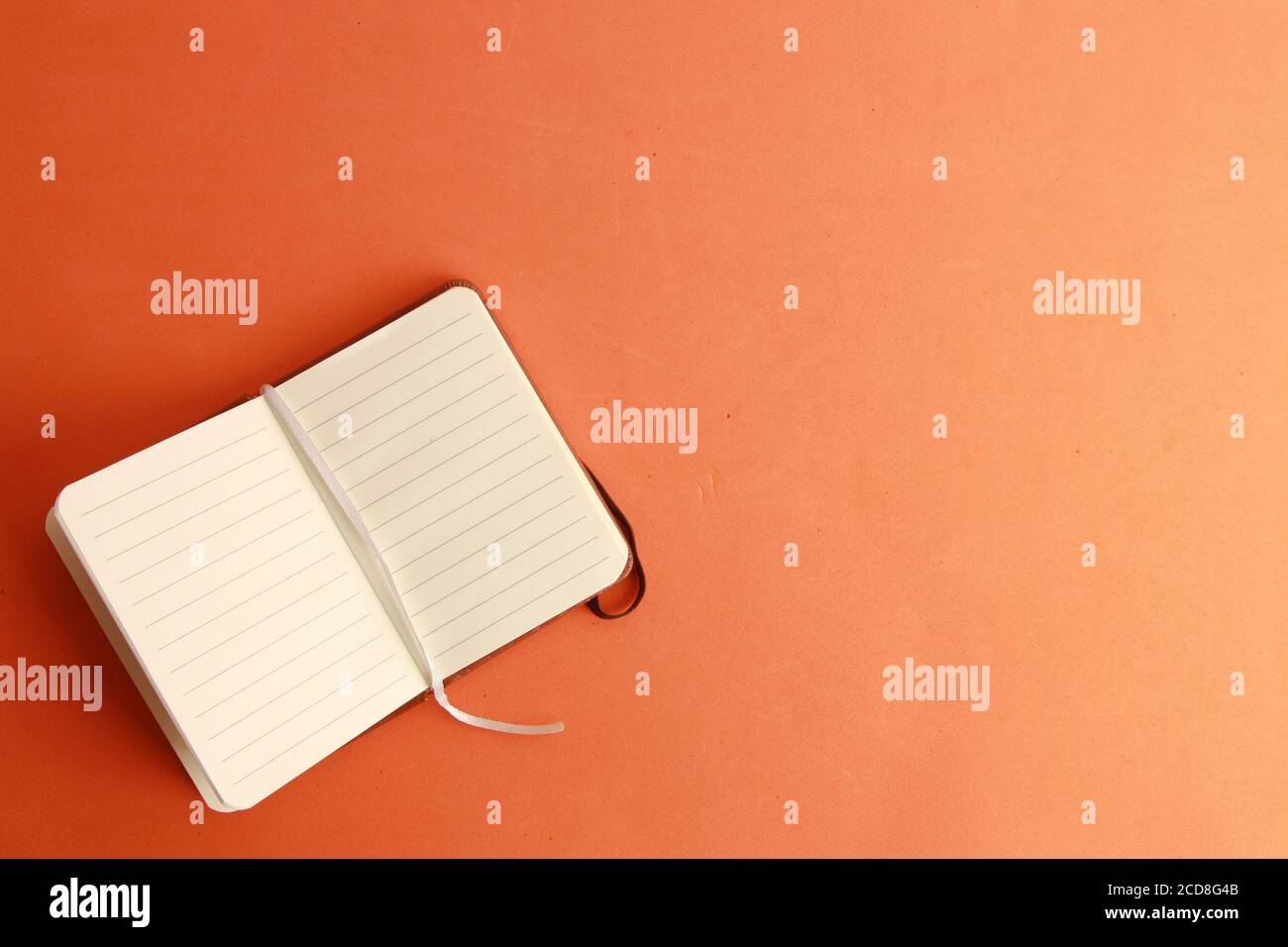 Overhead shot of a brown leather open notebook Stock Photo - Alamy