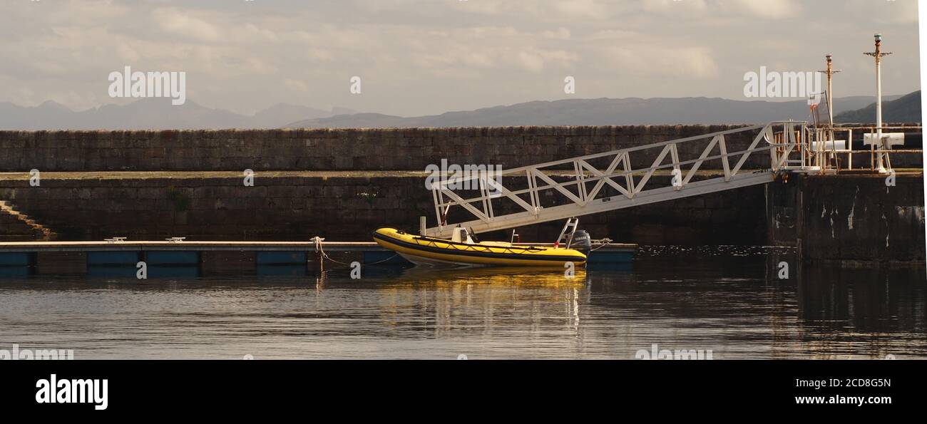 A small speed boat moored at Ardrishaig pier, Crinan Canal, Argyll ...