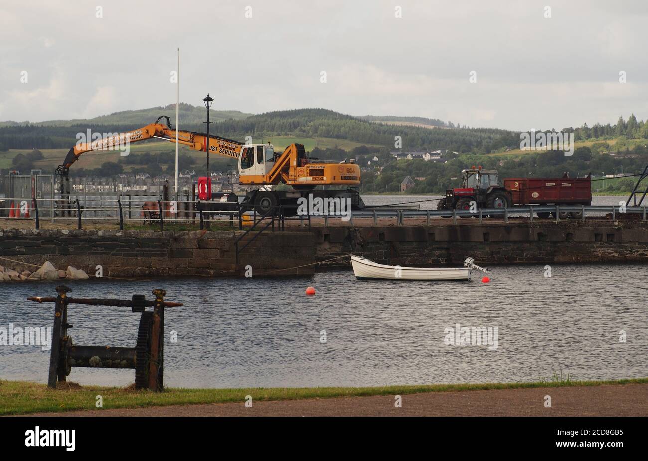 A JST Services Liebherr handler machine and tractor with trailer on the ...