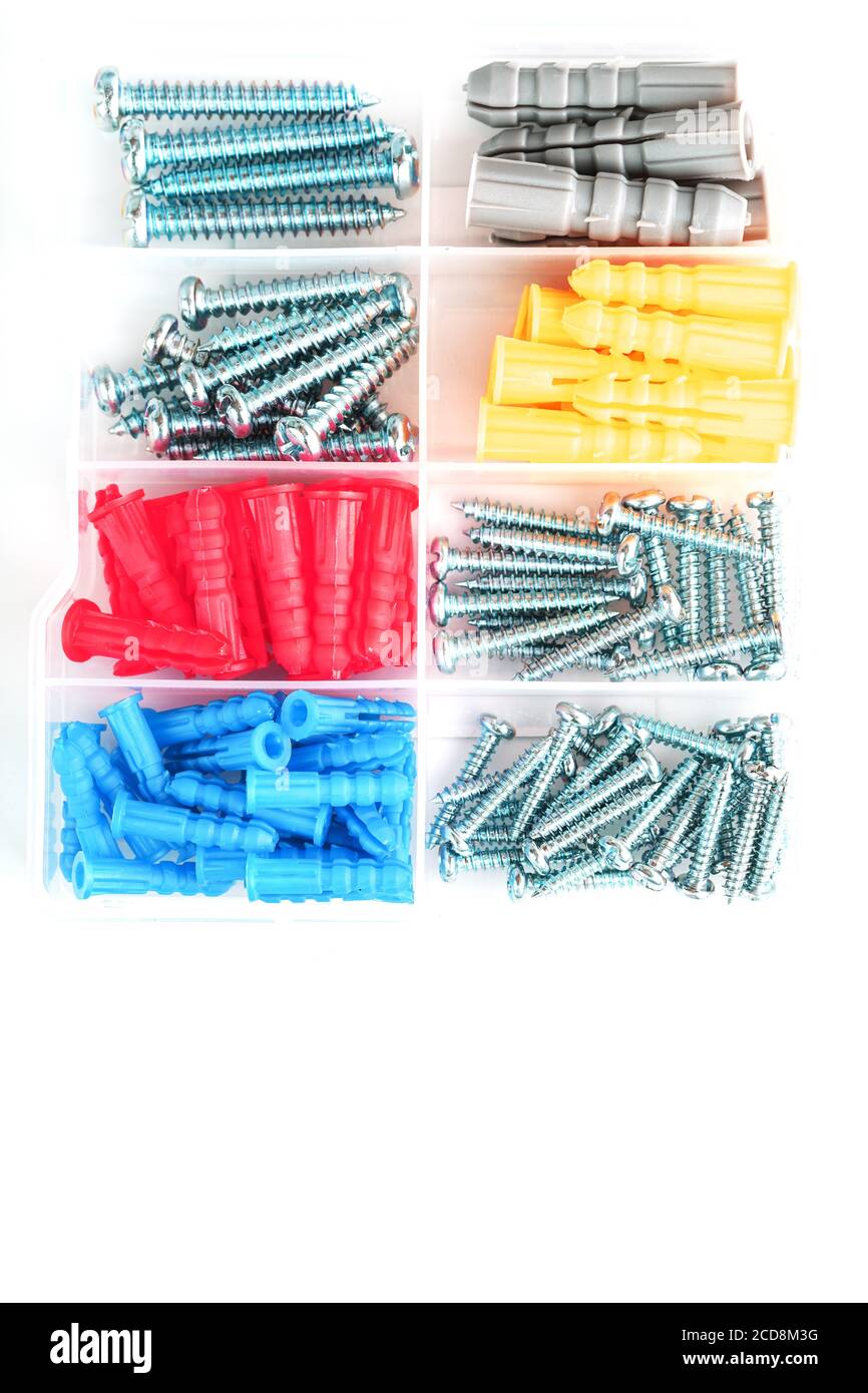 Box with steel Screws and plastic dowels of various sizes Stock Photo ...