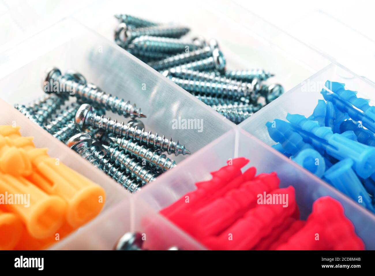 Box with steel Screws and plastic dowels of various sizes Stock Photo ...
