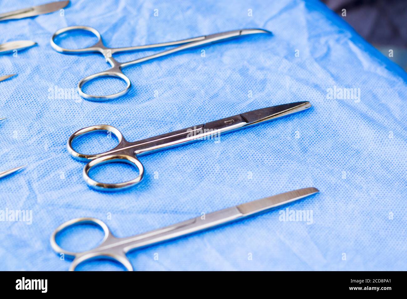 Surgical scissors on the blue sterile table, operation table Stock ...
