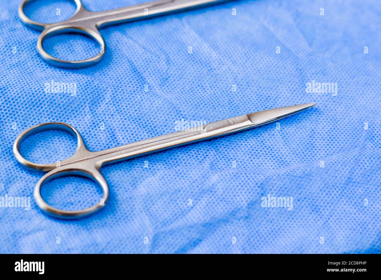 Surgical scissors on the blue sterile table, operation table Stock ...