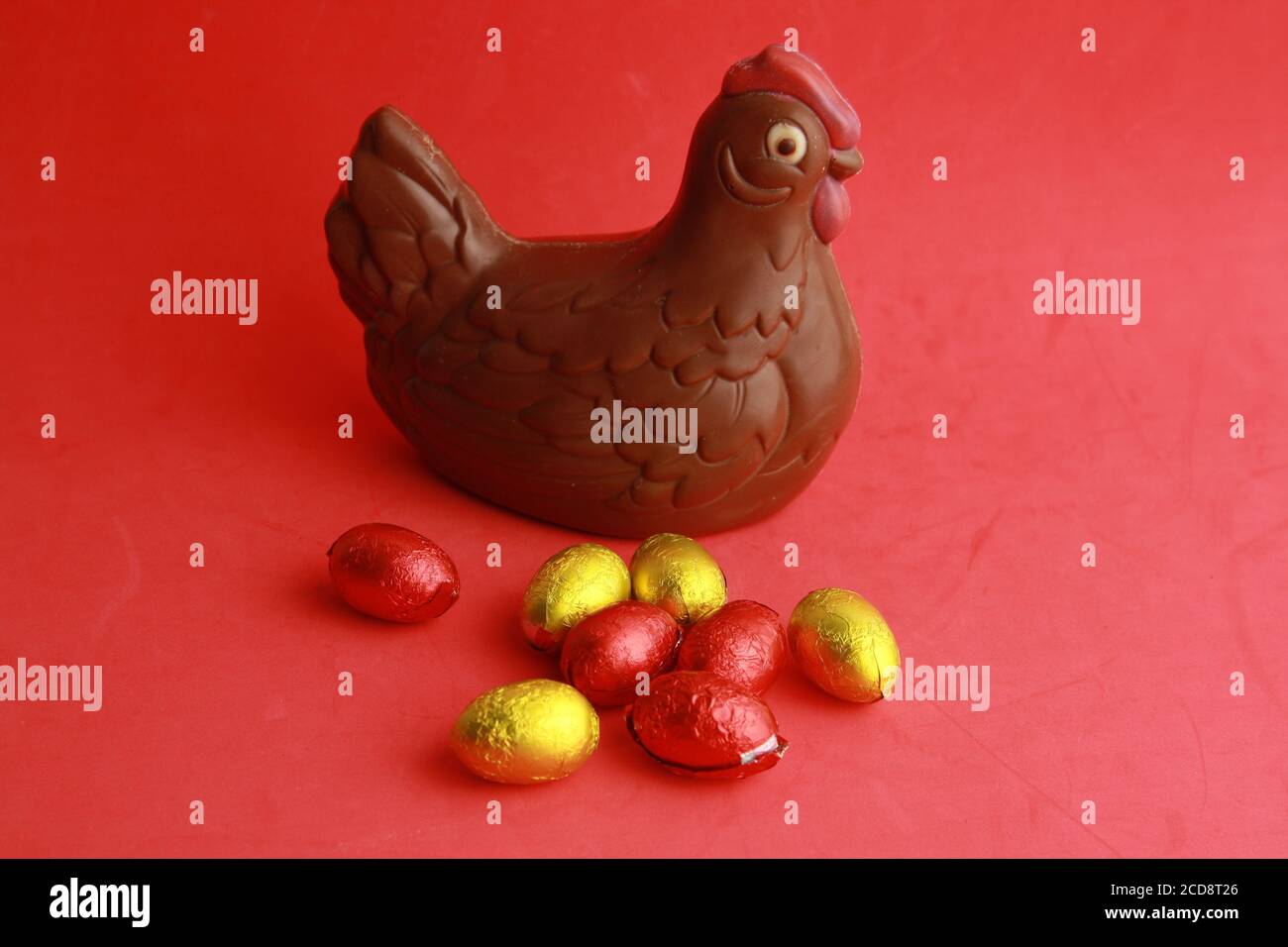 Close up shot of chocolate hen laying Easter eggs Stock Photo - Alamy