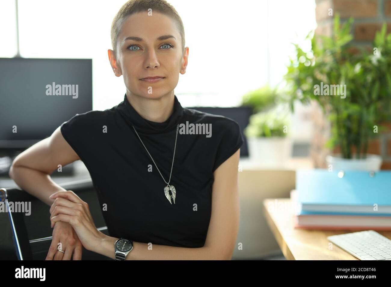 Female employee sitting at workplace in the office Stock Photo - Alamy