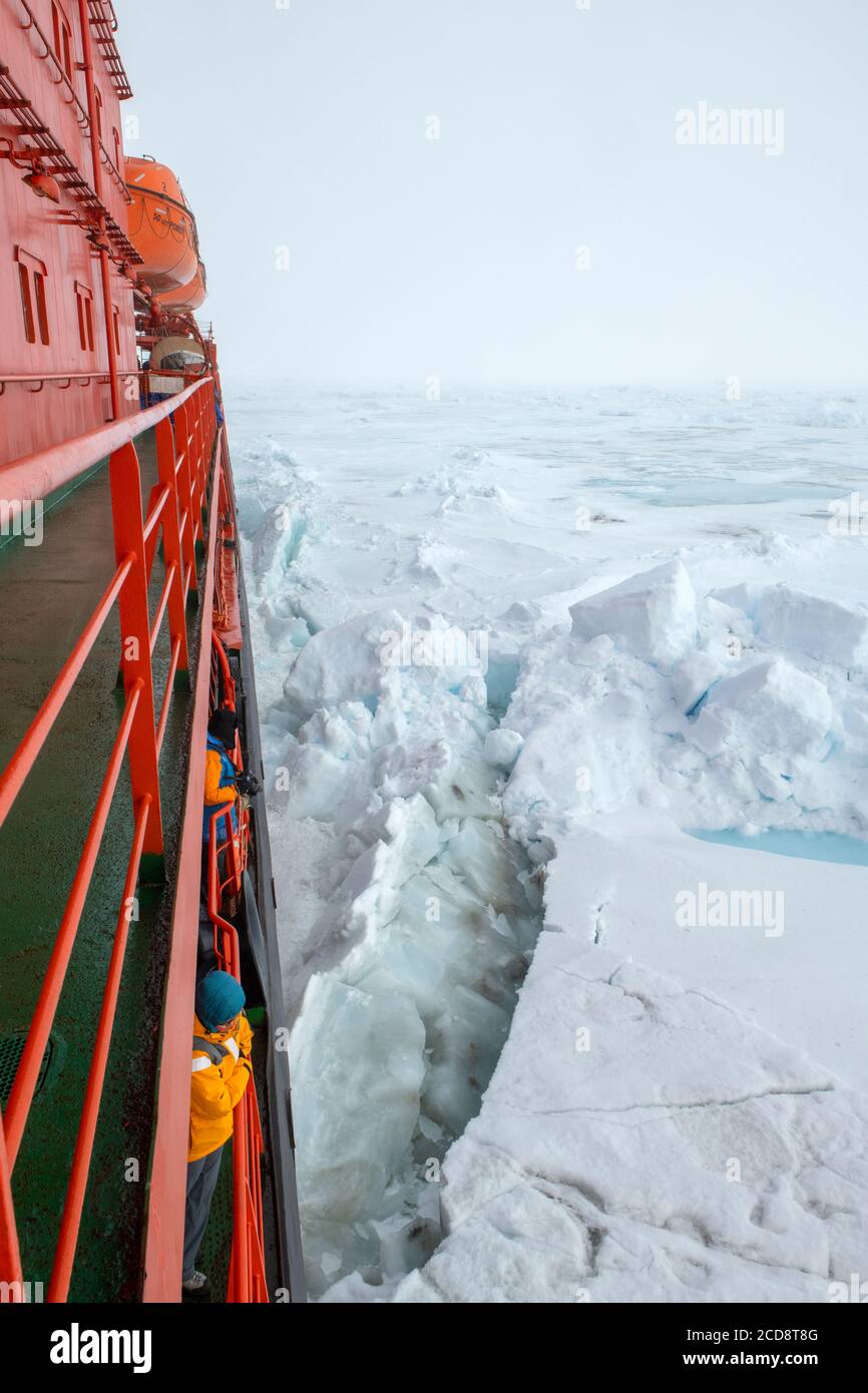Russia, High Arctic. Crashing through thick sea ice at 89 degrees north ...