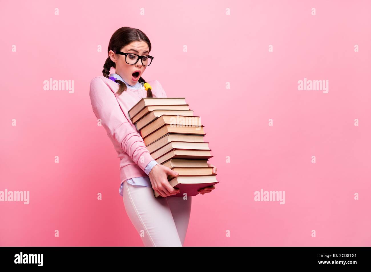 Overwhelmed woman with books hi-res stock photography and images - Alamy