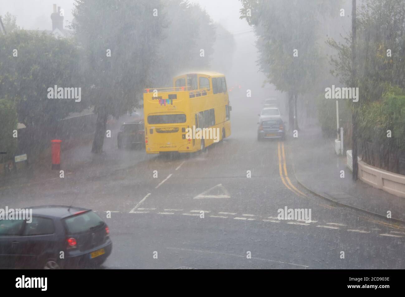 Bus driving in rain hi-res stock photography and images - Alamy