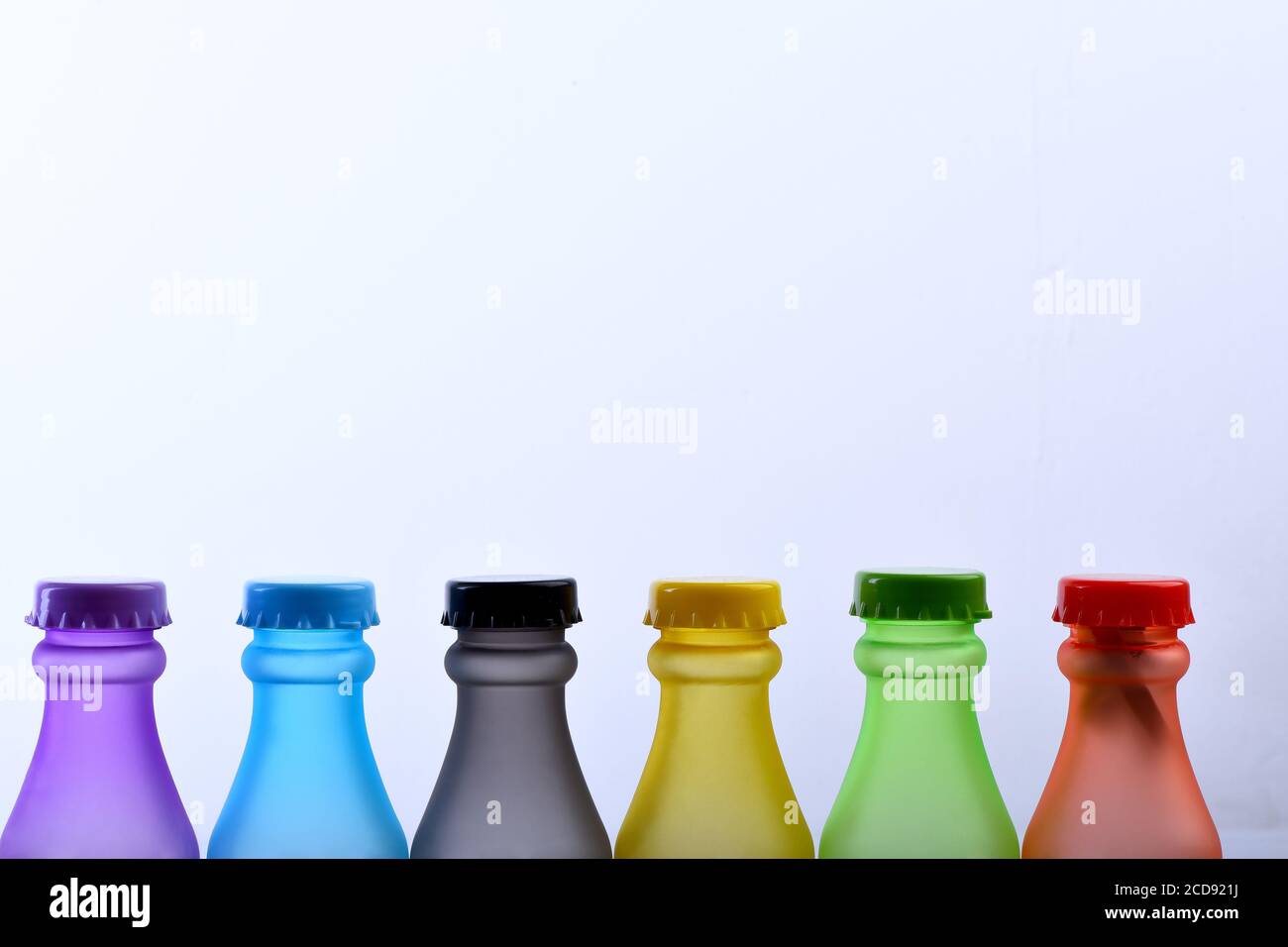 Set of bottles in different color. Colour choice and containers concept ...