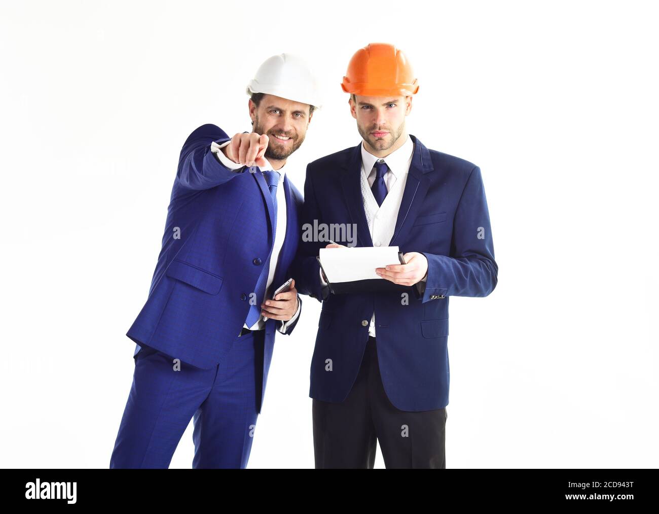 Project management, building concept. Businessman and young worker with ...