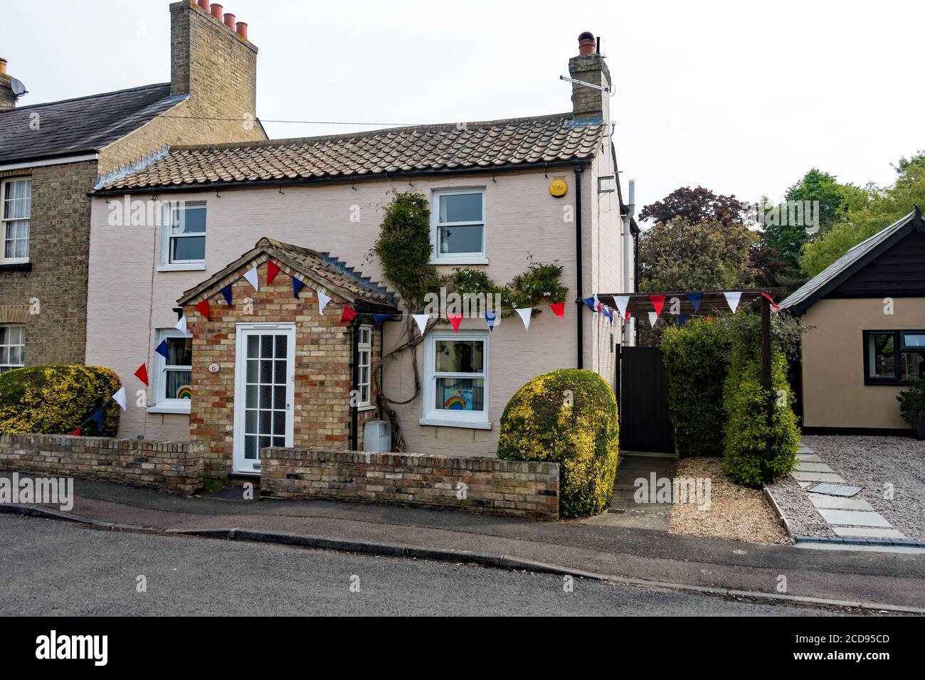 Cottage flying bunting to celebrate the 75th anniversary of VE day ...