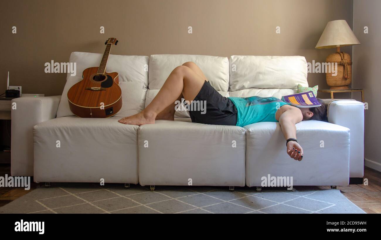 Girl sleeping book over face hi-res stock photography and images - Alamy