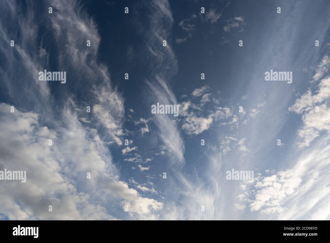 blue sky with mixed clouds wide angle upward shot at summer daytime ...