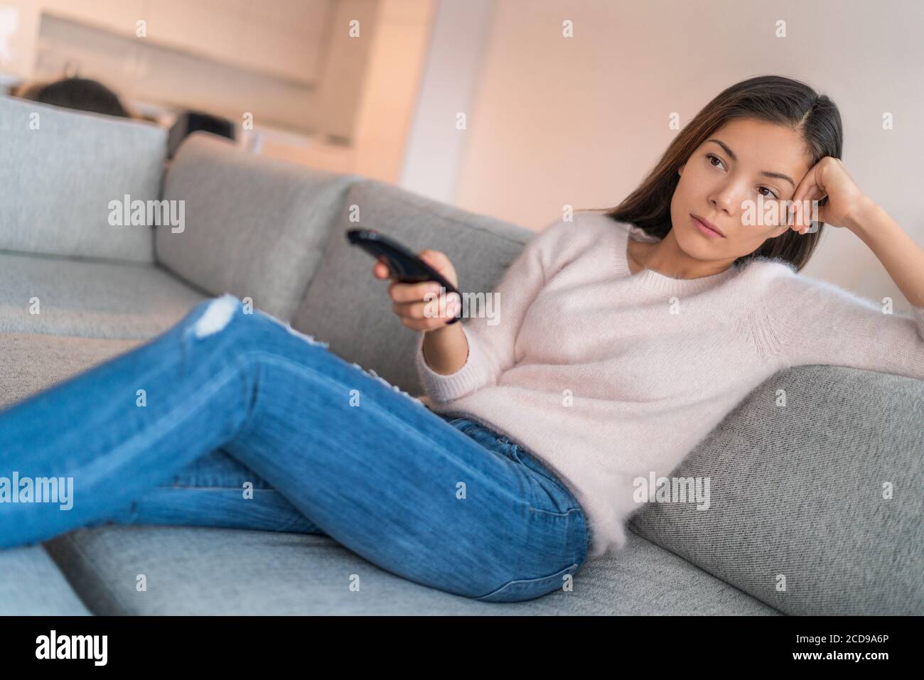 Woman watching tv alone hi-res stock photography and images - Alamy