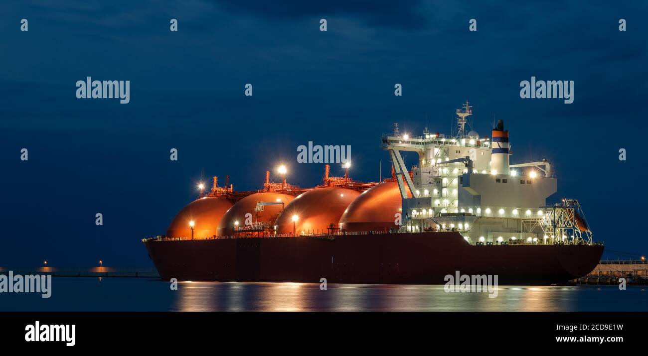 Tanker in the port with lights on, night photography Stock Photo - Alamy