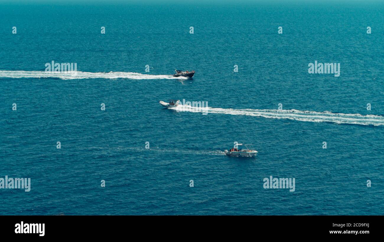 Three boats meeting in the sea Stock Photo - Alamy