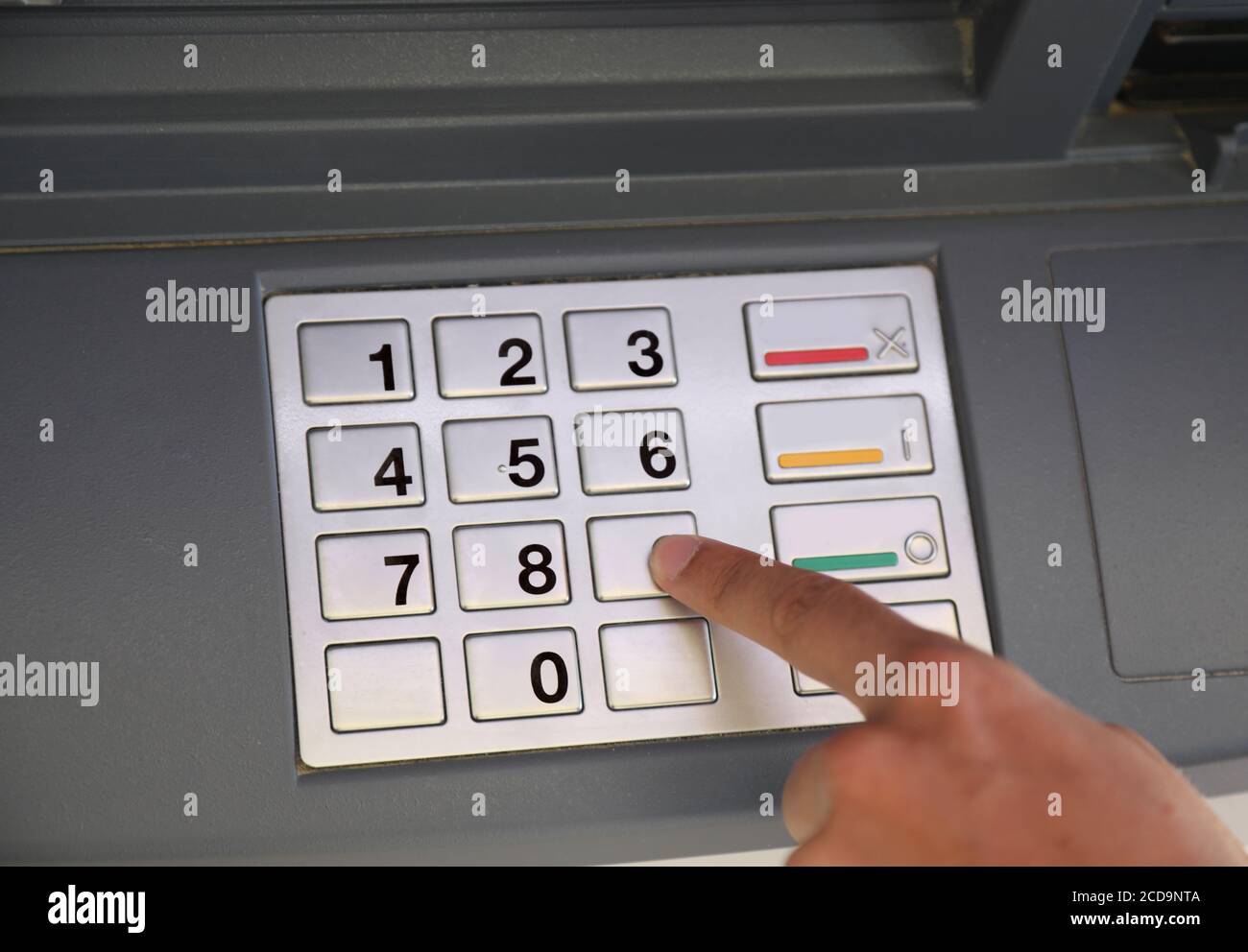 person typing the secret code into the ATM machine keyboard Stock Photo ...