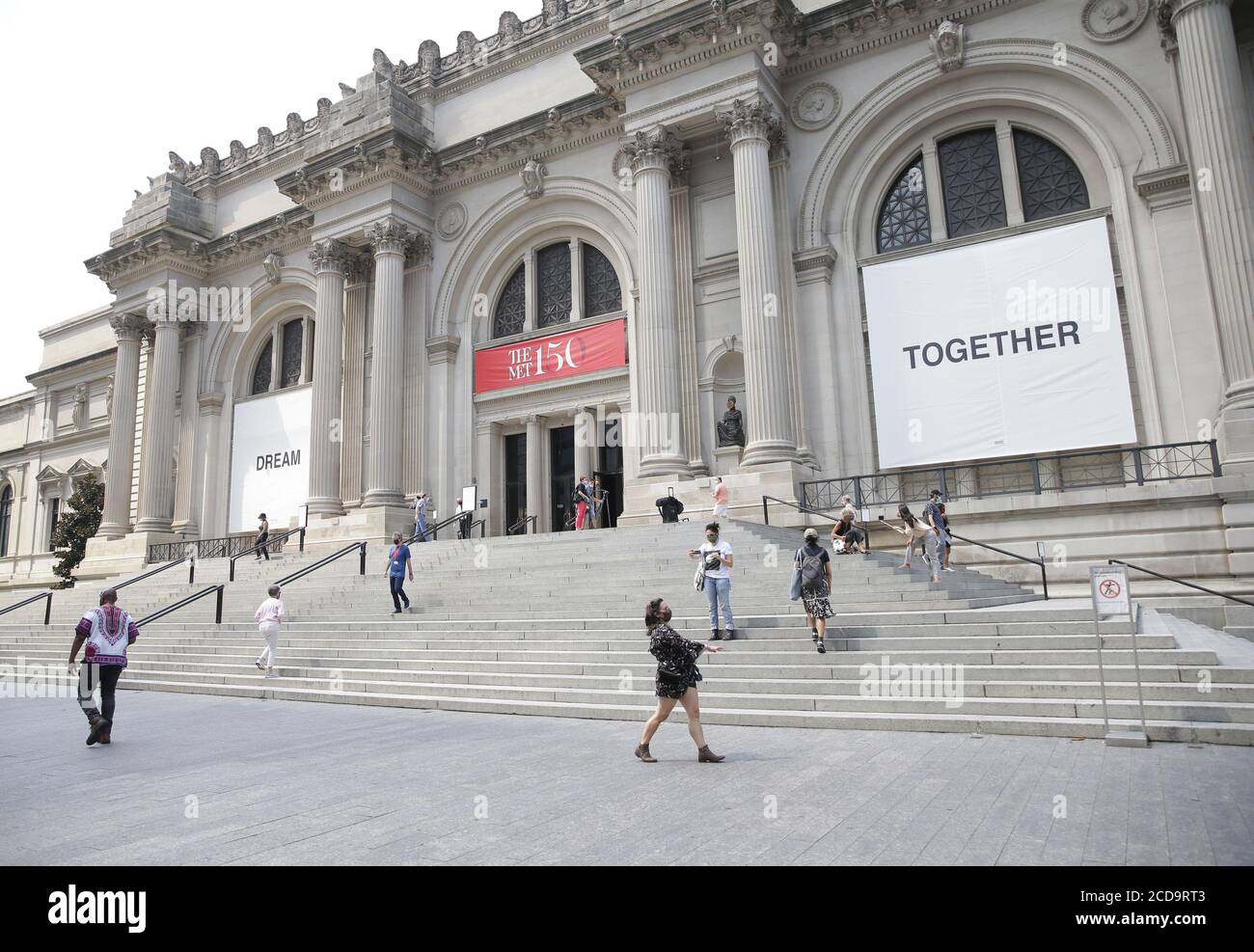 New York, United States. 27th Aug, 2020. Pedestrians walk by the ...