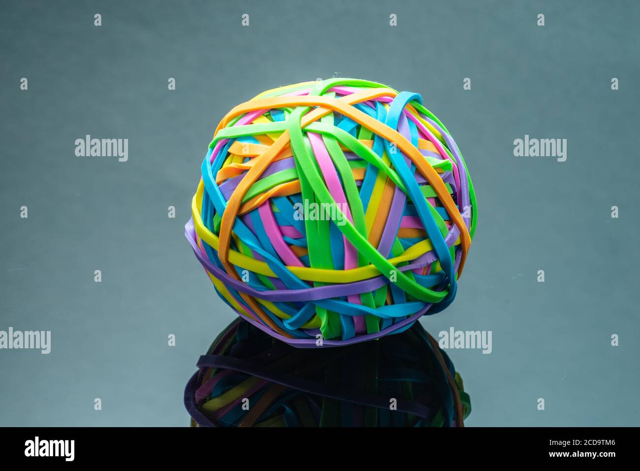 Rubber Band Ball.Colorful rubber band Paper Bills Stock Photo - Alamy