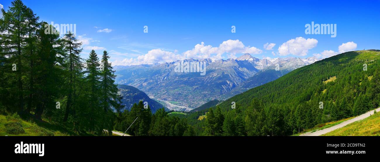 Visp, Switzerland: View on the mountains with the city in the valley ...