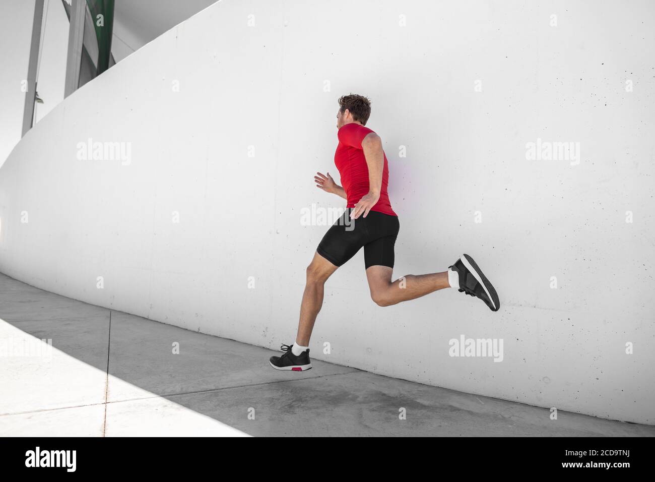 Athlete man running away sprinting doing cardio hiit workout exercise ...