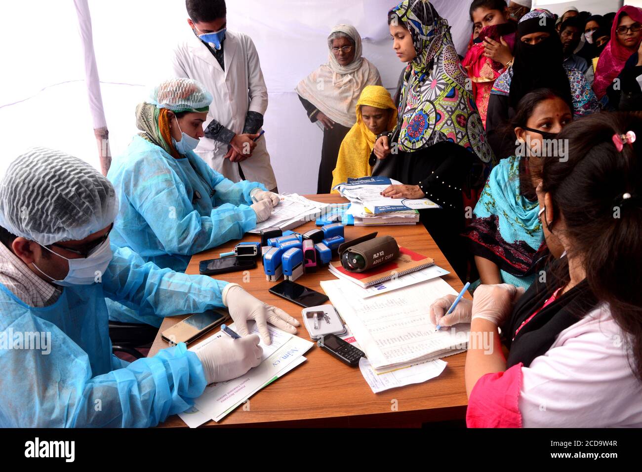 Doctor examines patients at a temporary medical camp ( Especially made ...