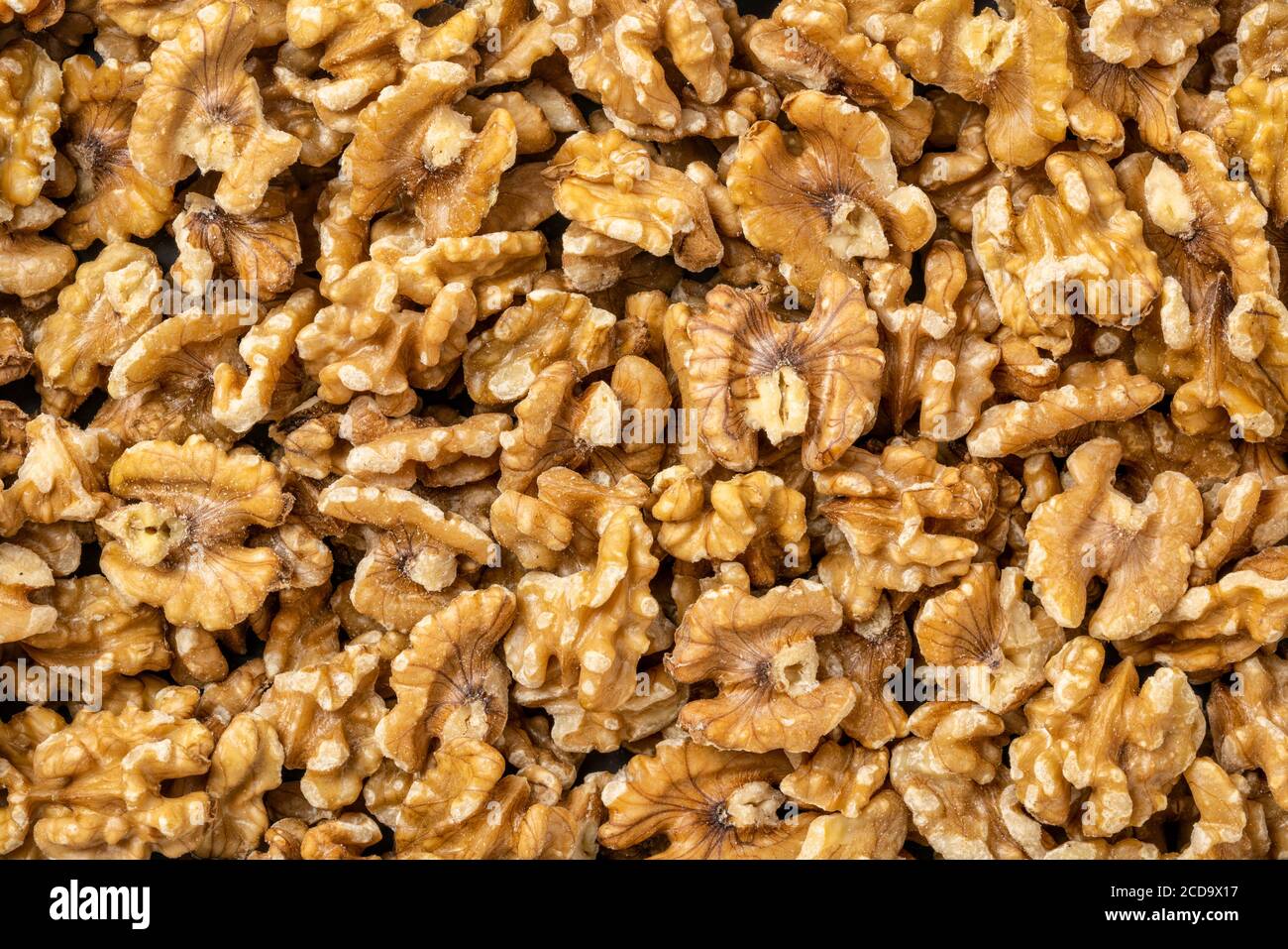 shelled English walnuts background - superfood concept Stock Photo - Alamy