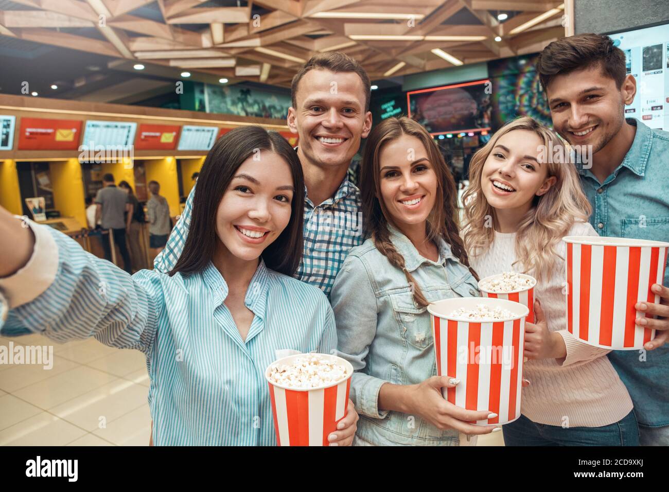 Young people friends together in the cinema Stock Photo - Alamy