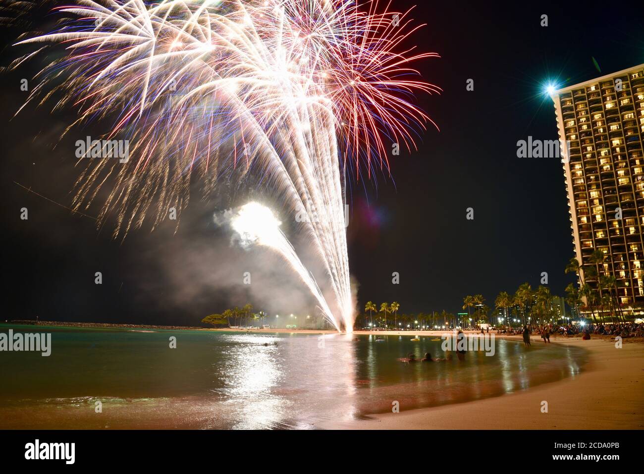 Weekly firework display over touristy beach and waterfront, in front of ...
