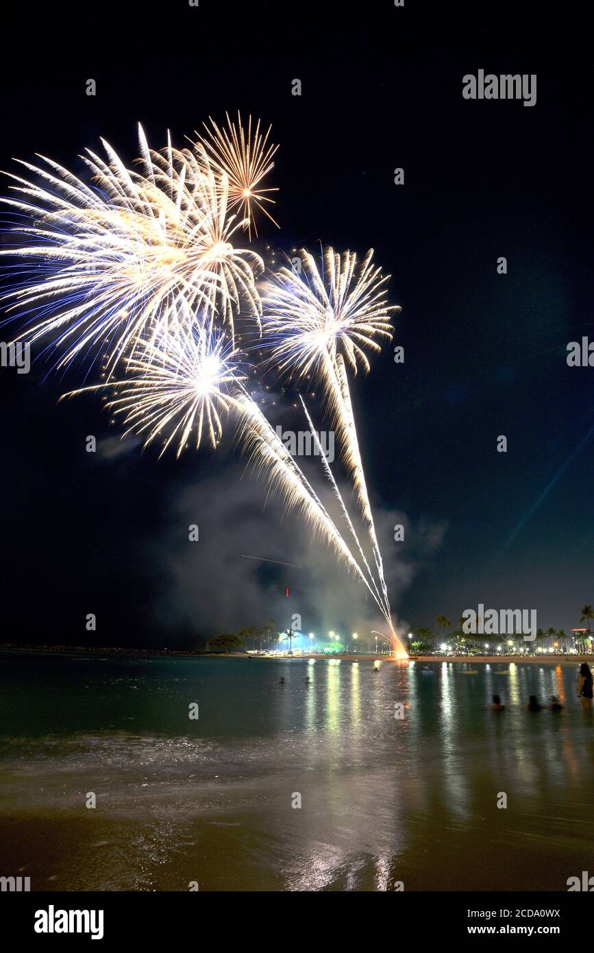Weekly firework display over touristy beach and waterfront, in front of ...