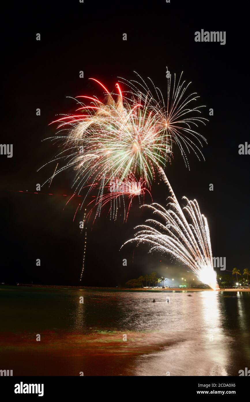 Weekly firework display over touristy beach and waterfront, in front of ...