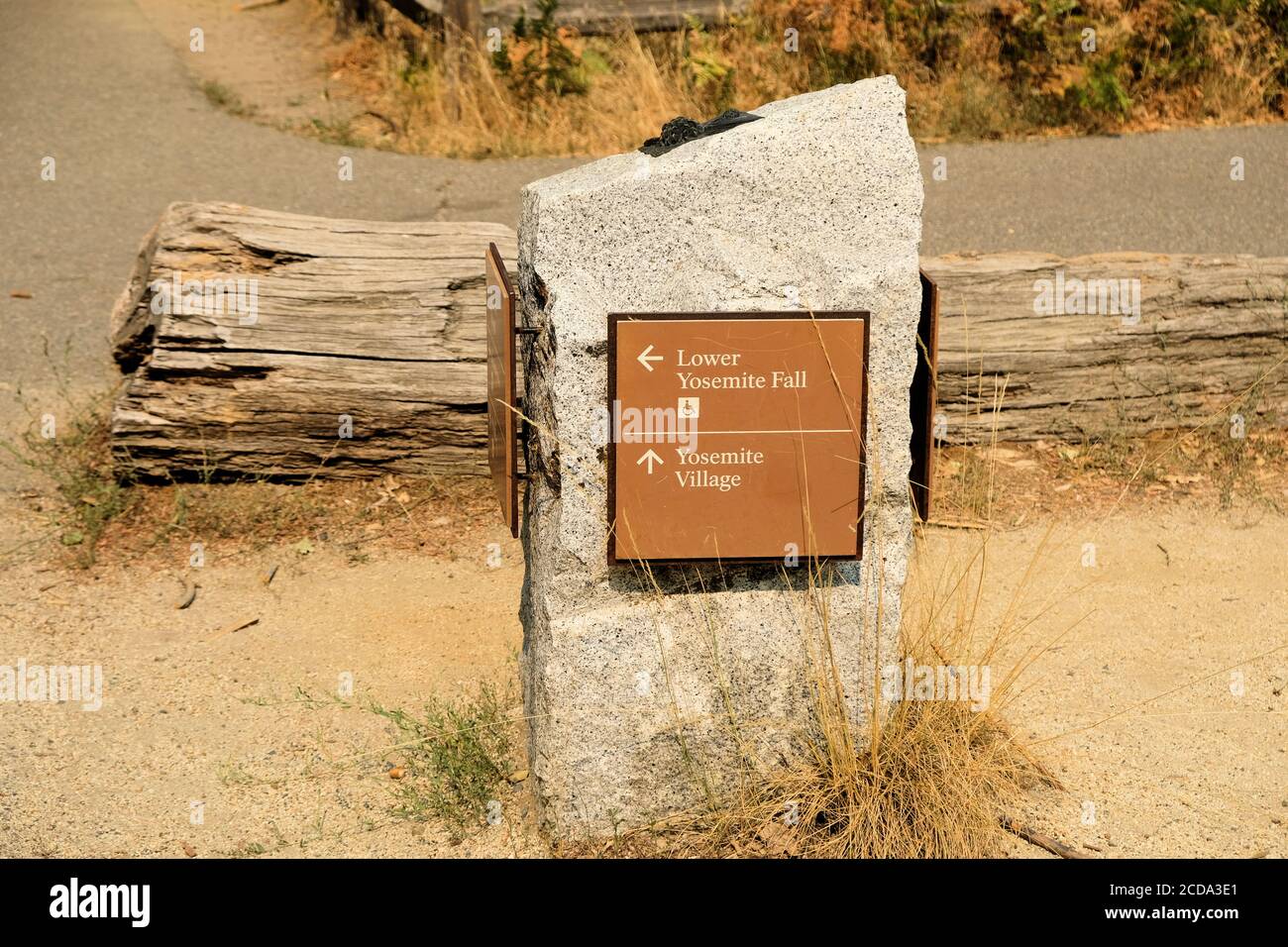 Stone post sign at Yosemite National Park in California pointing to ...