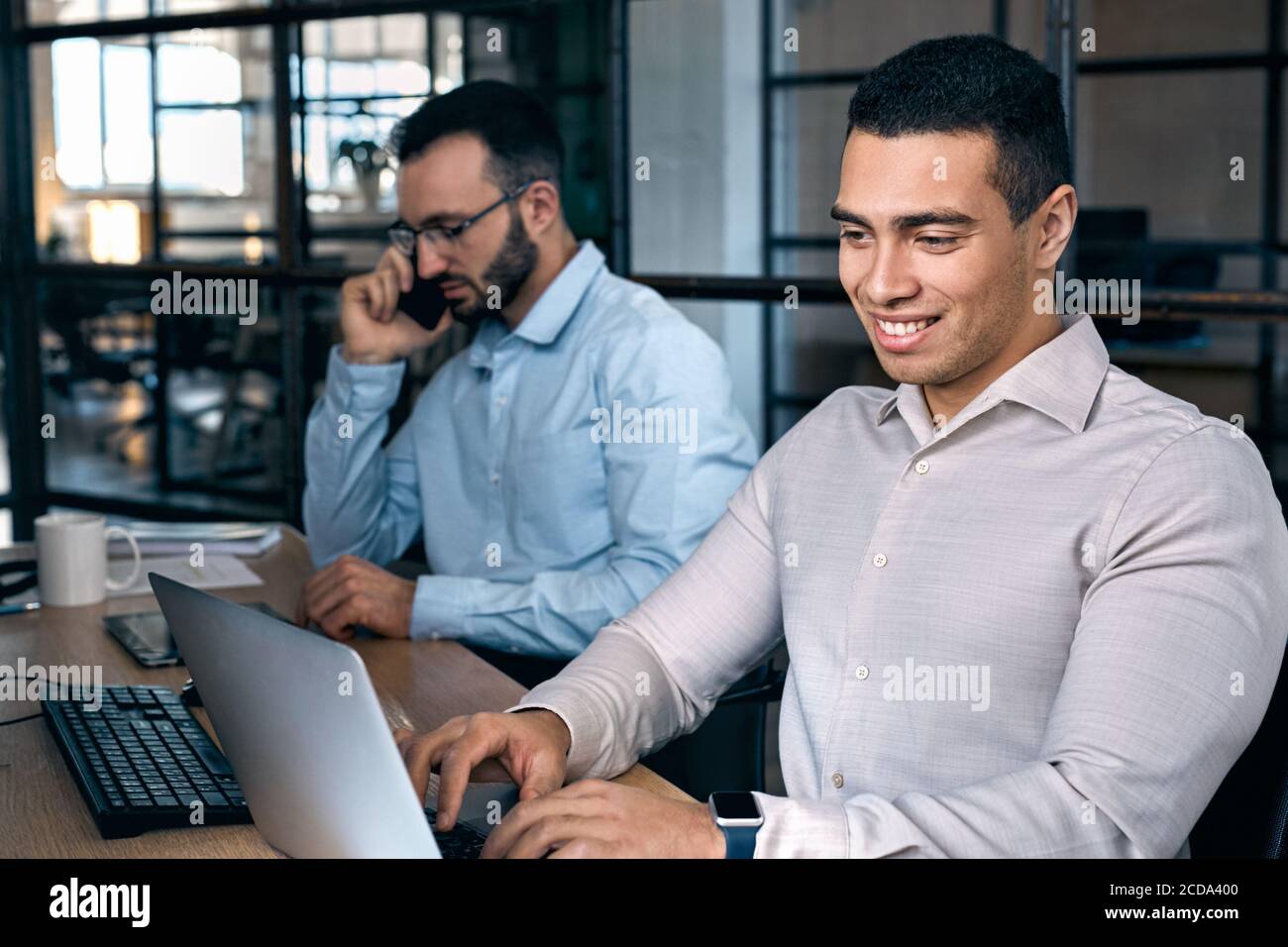 Two happy men sitting on hi-res stock photography and images - Alamy
