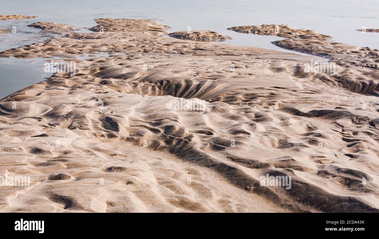 Low tide showing sand reliefs Stock Photo - Alamy