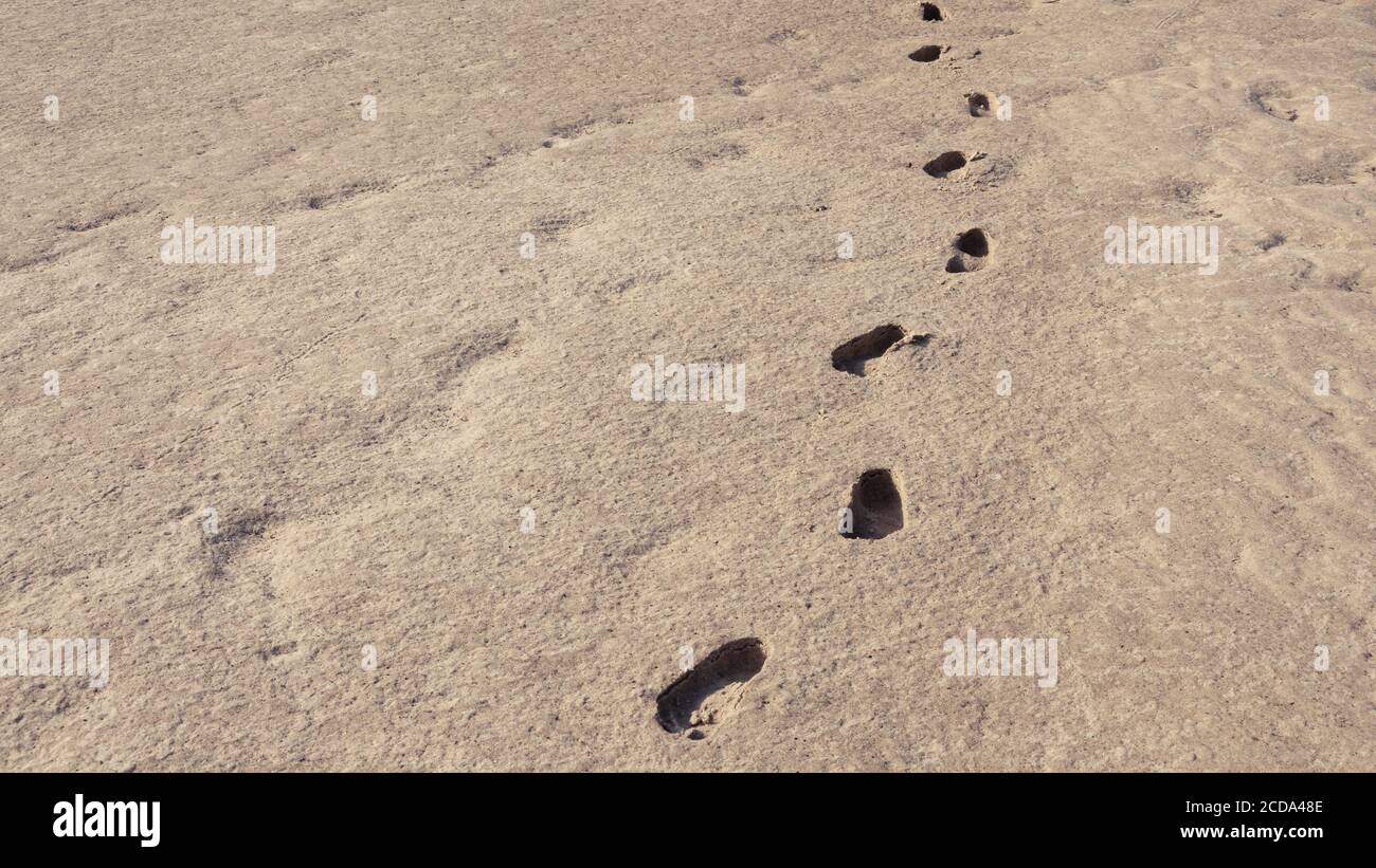 Foot marks on the sand Stock Photo - Alamy