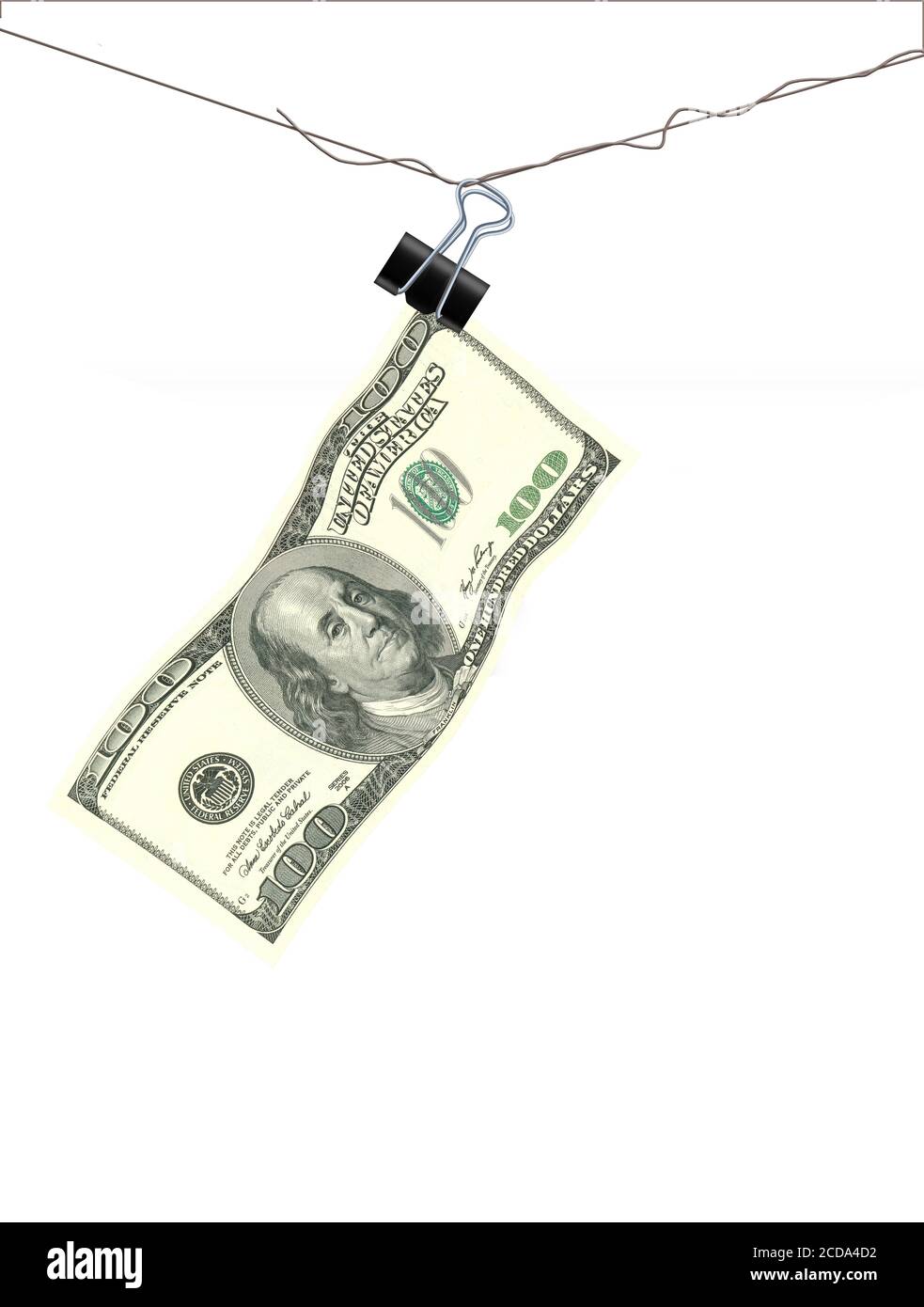 A one hundred dollar bill hangs on a wire secured by a paper clamp and ...