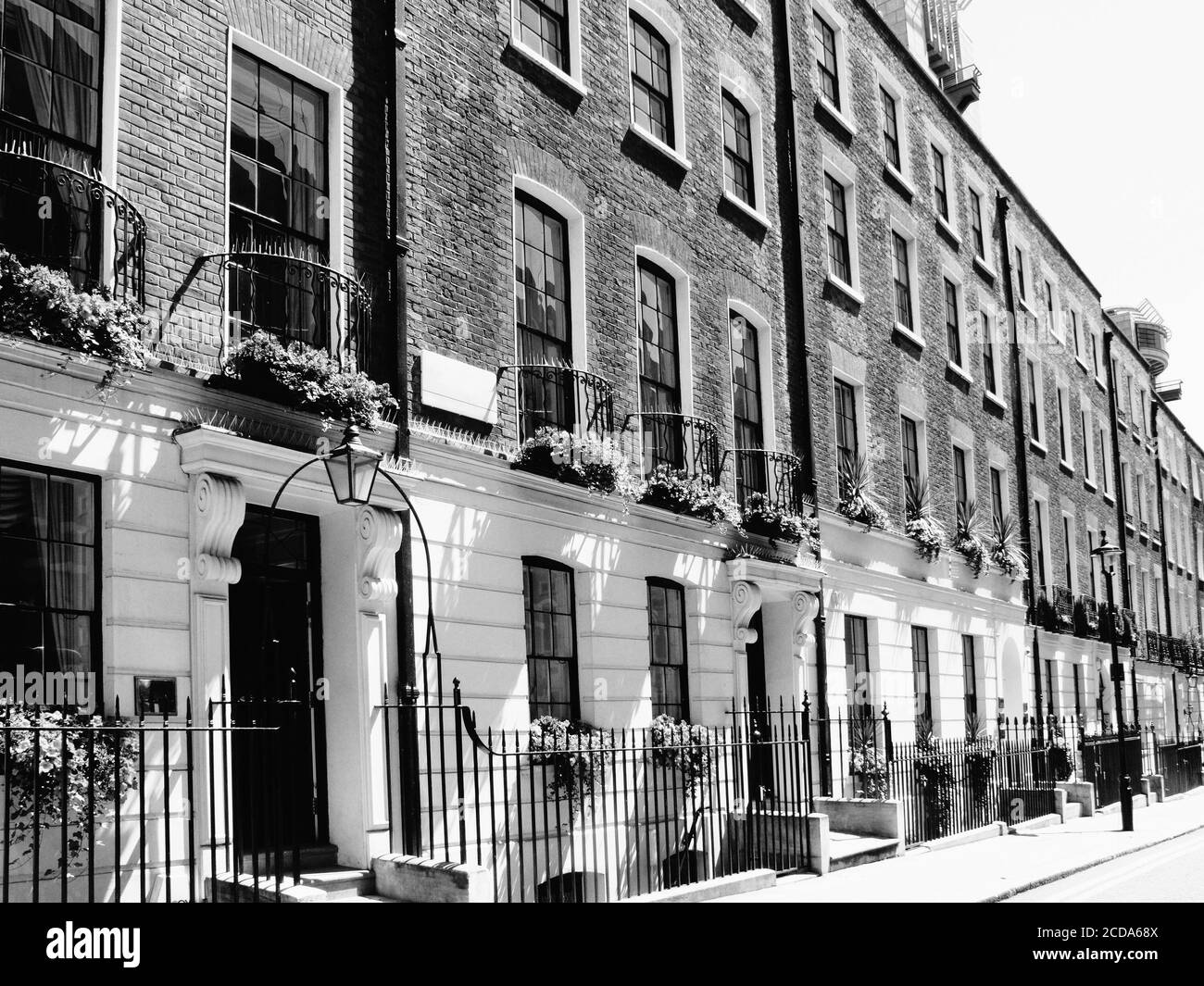 Black and white image of old fashioned Regency Georgian terraced town ...