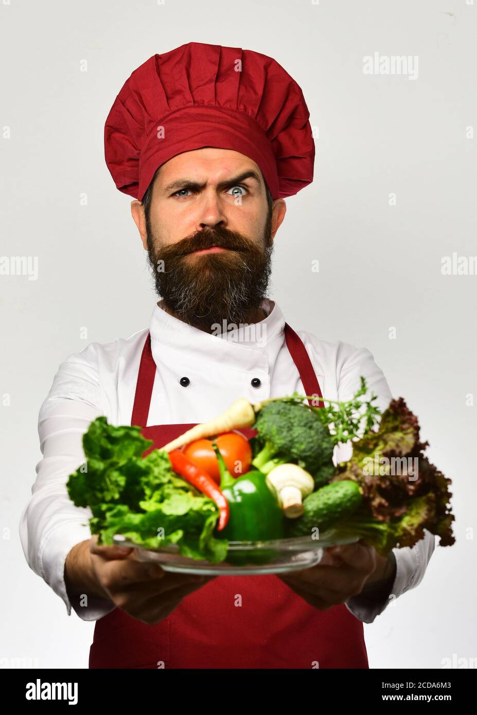 Healthy nutrition and cuisine concept. Chef holds bowl with fresh ...