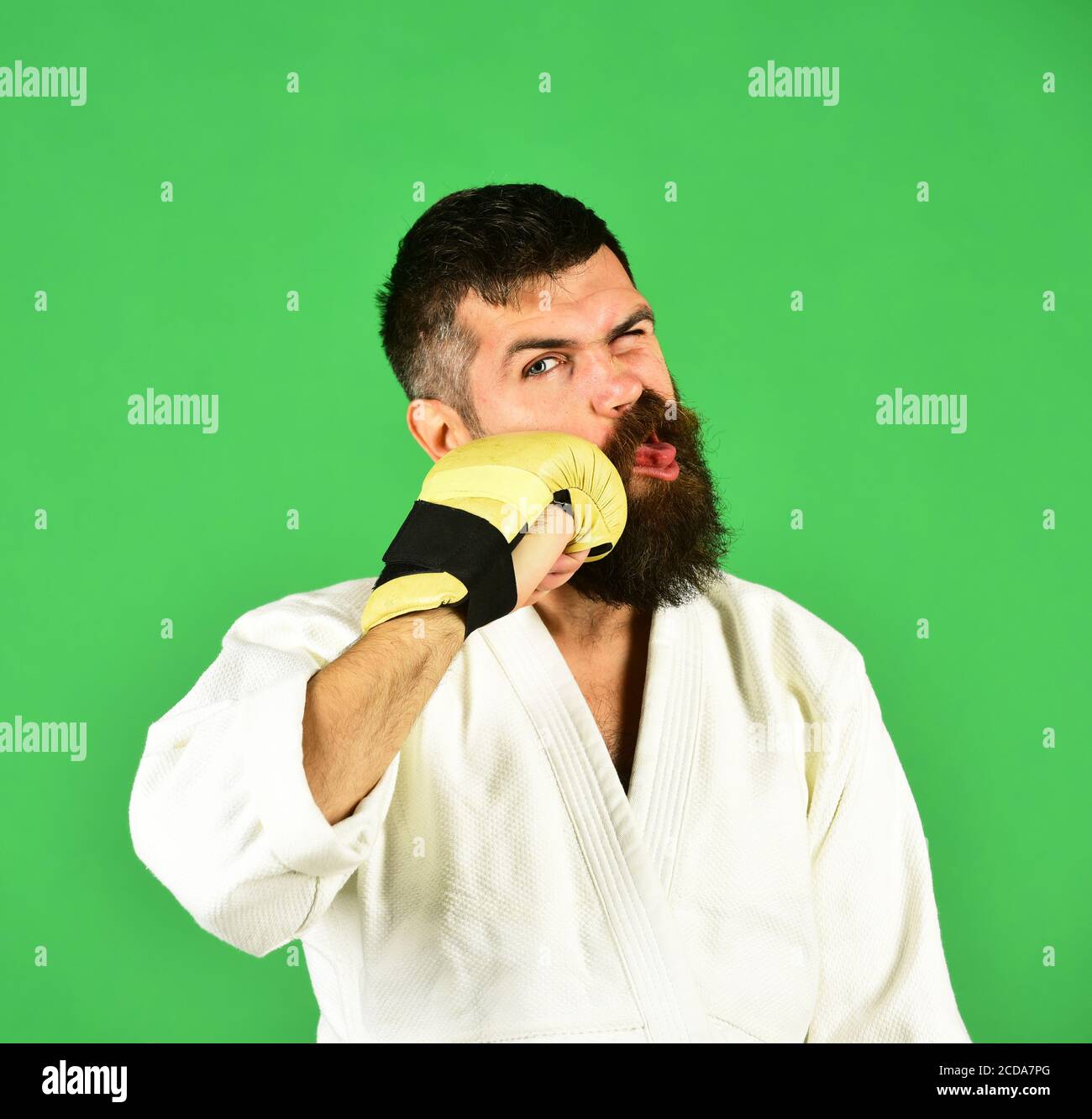 Japanese martial arts concept. Combat master hits himself with fist ...