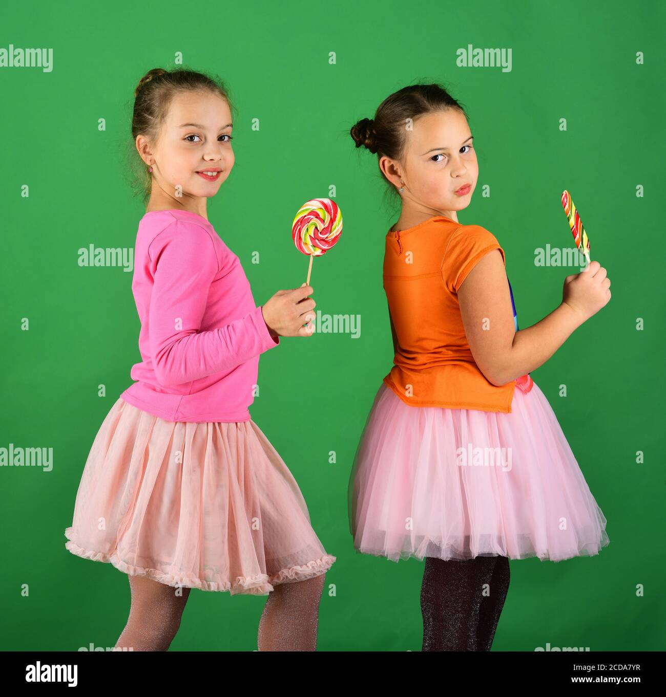 Confectionery and childhood concept. Children with firty faces pose ...