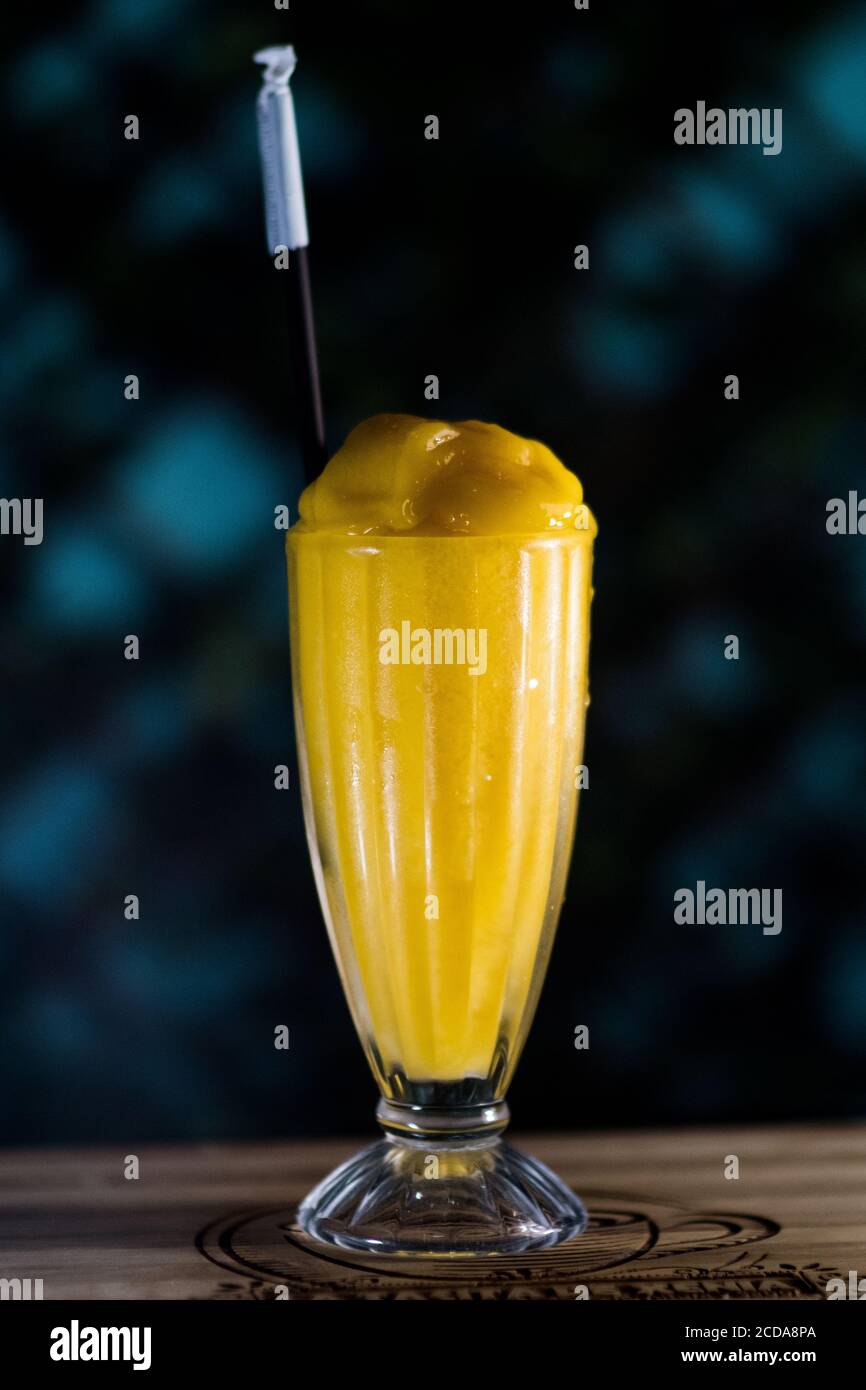 Vertical shot of a yellow smoothie Stock Photo - Alamy