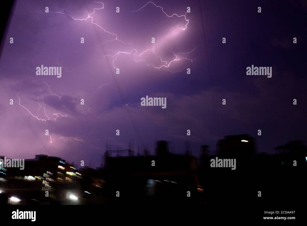Lightning flashes in the sky over the Dhaka City during a storm in ...