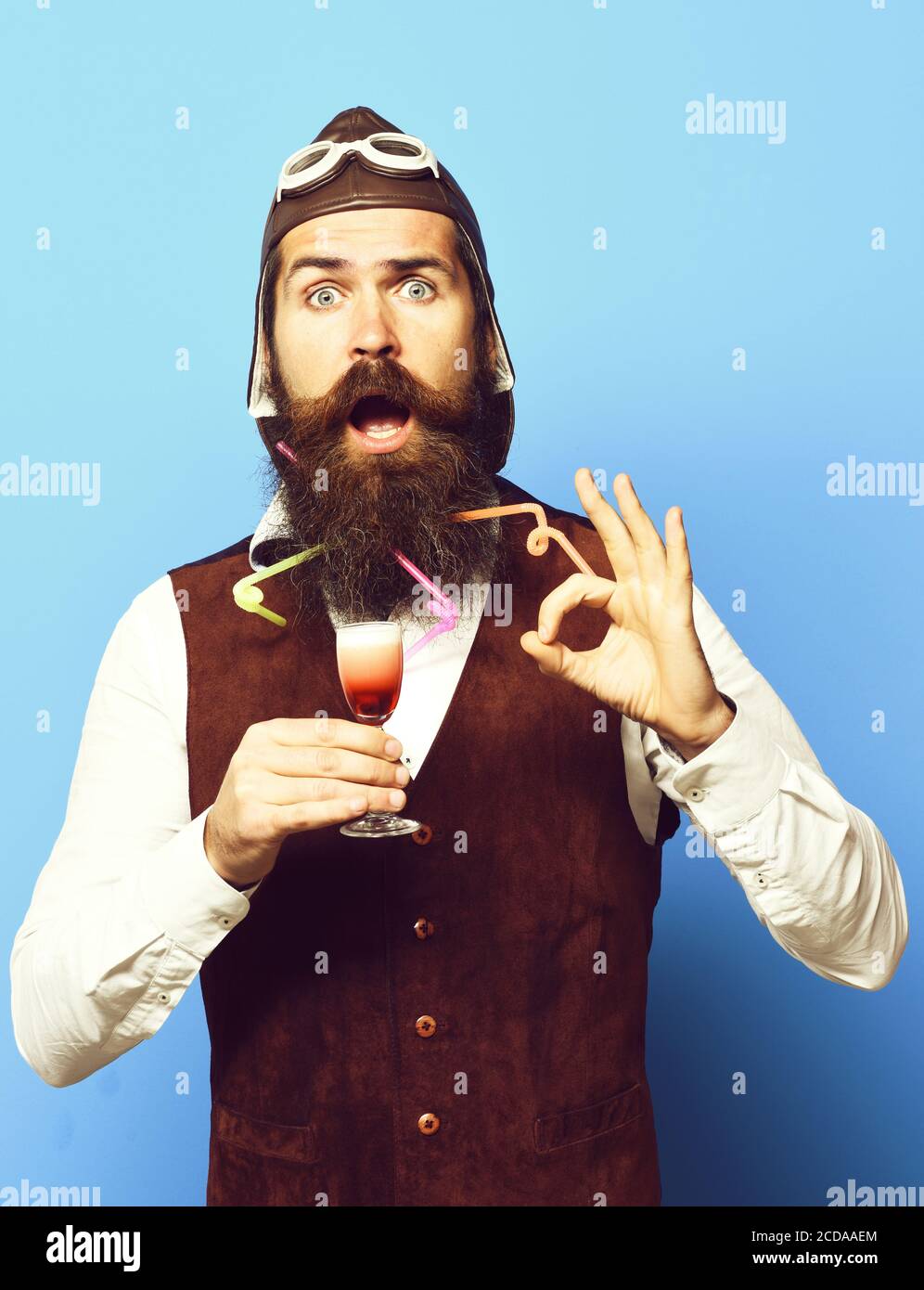 handsome bearded pilot or aviator man with long beard and mustache on ...